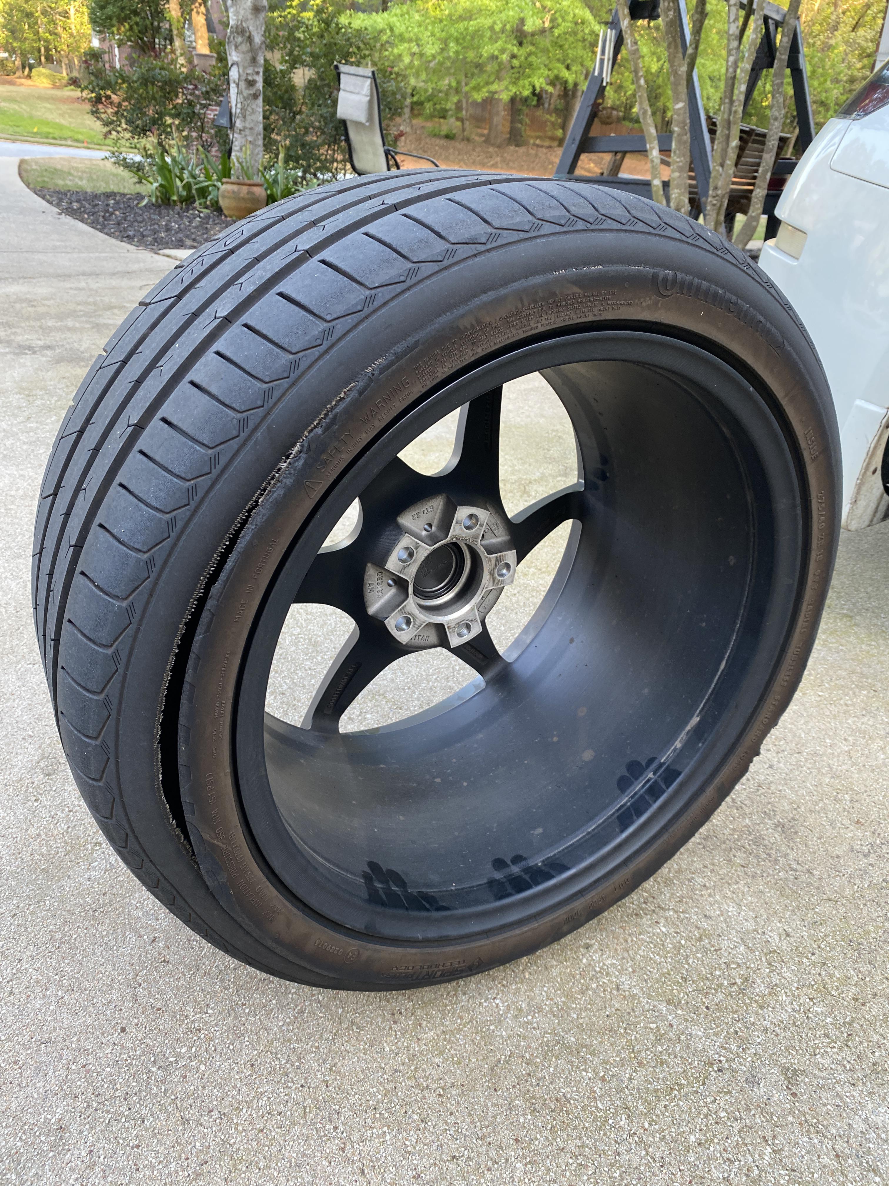 Rear tire ripped open - has anyone ever had a pop like this? Driven at least 2k miles on it ...