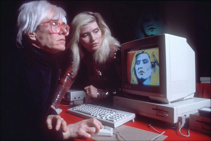 Andy Warhol and Debby Harry working on an Amiga Computer - 1985 | Scrolller