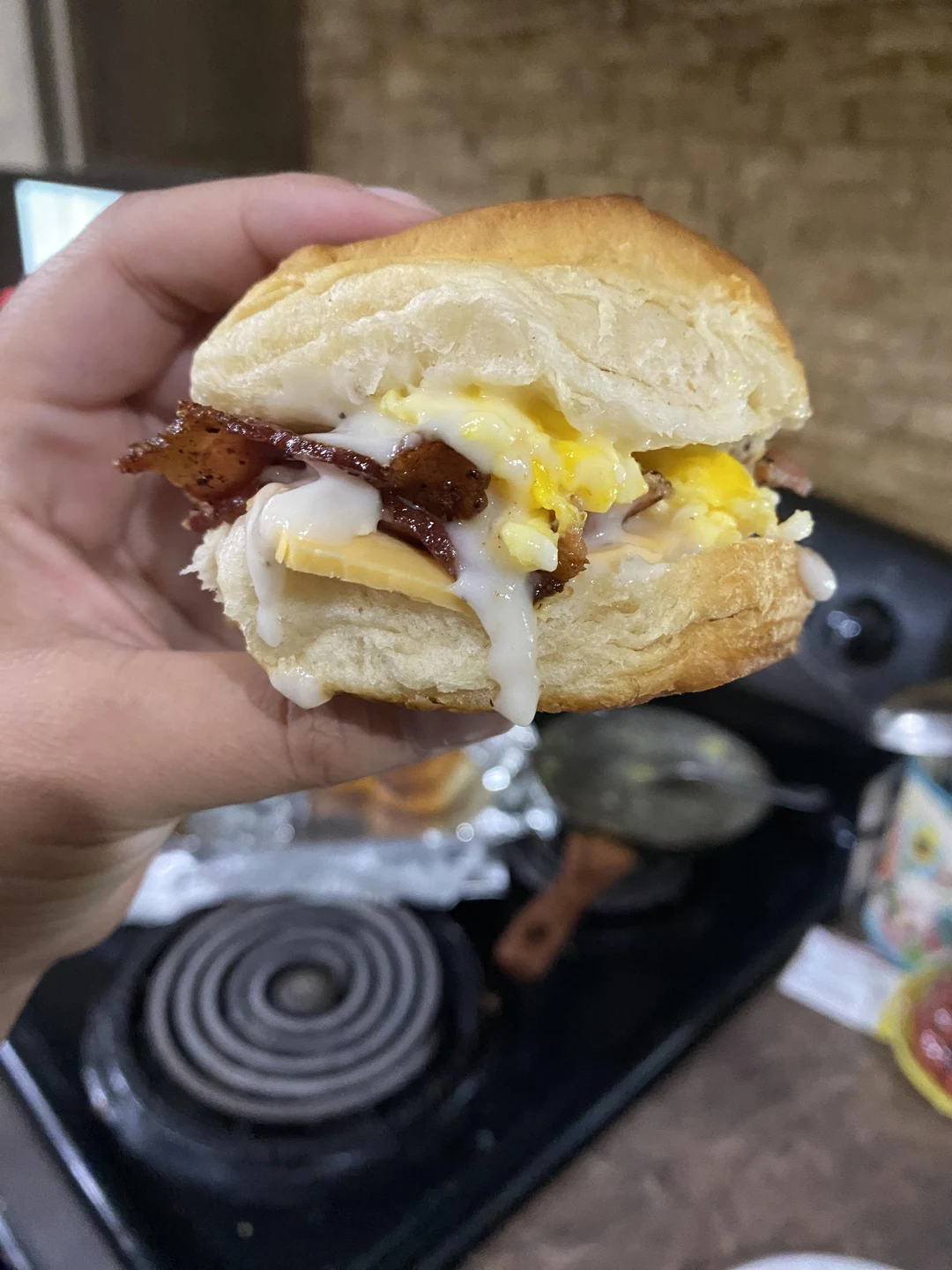 Biscuit and gravy breakfast sandwich [homemade] with bacon and fresh eggs | Scrolller