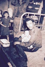 My Papaw holding my mother in 1957 after getting off work in the coal mines of Coeburn, Virginia ...