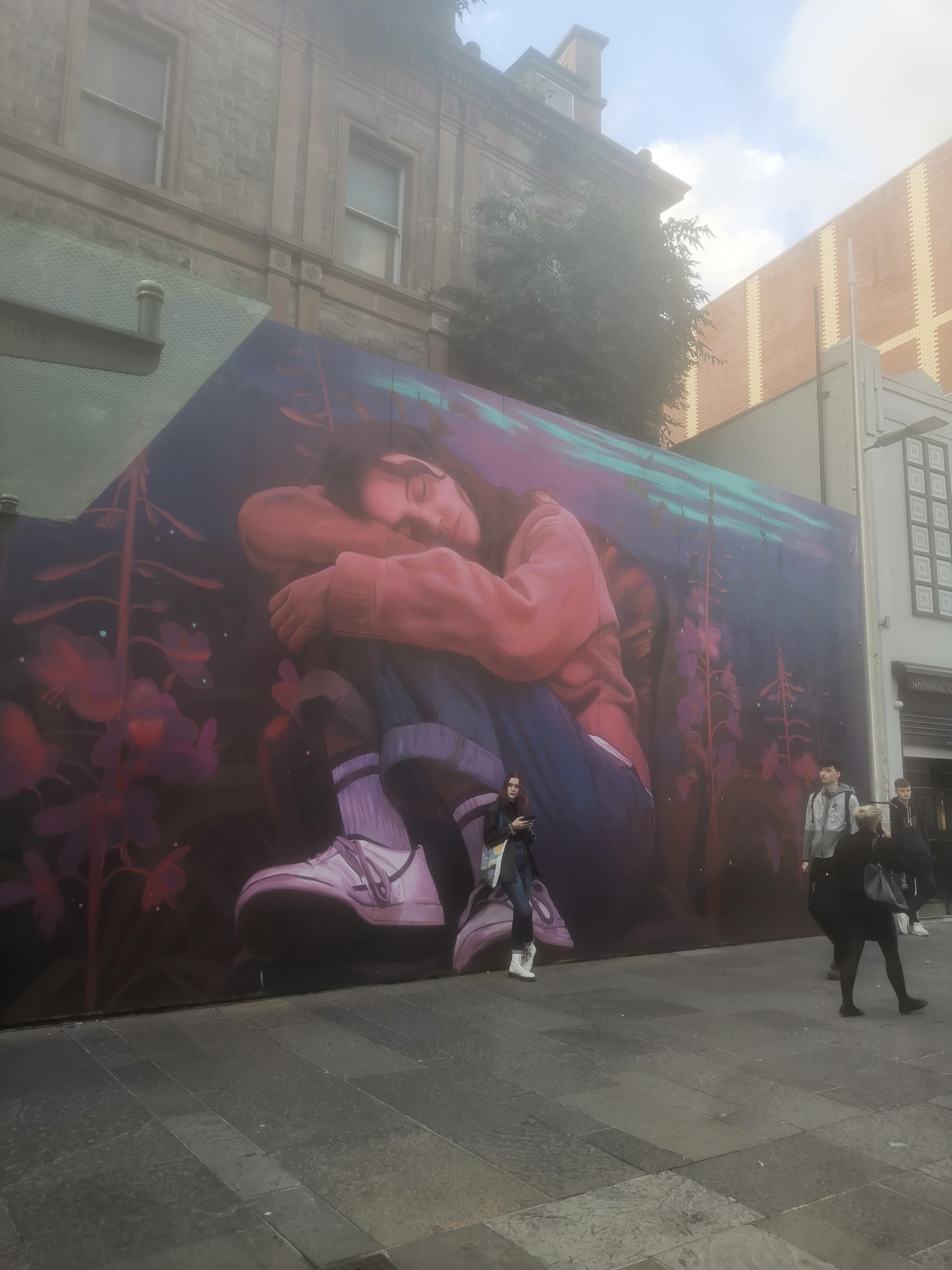 Sleeping girl Queen Street Belfast | Scrolller