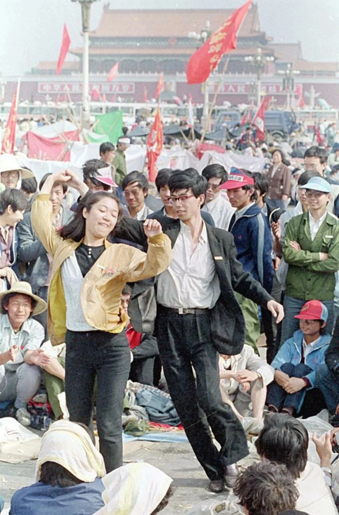 A couple dancing at Tiananmen Square before the tanks rolled in, 1989 | Scrolller