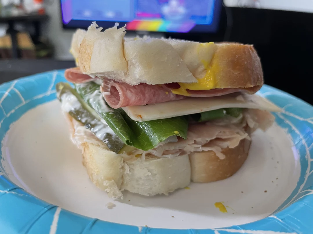 Turkey and salami with romaine, pickles, pepper jack cheese, mustard and mayo on sliced French ...