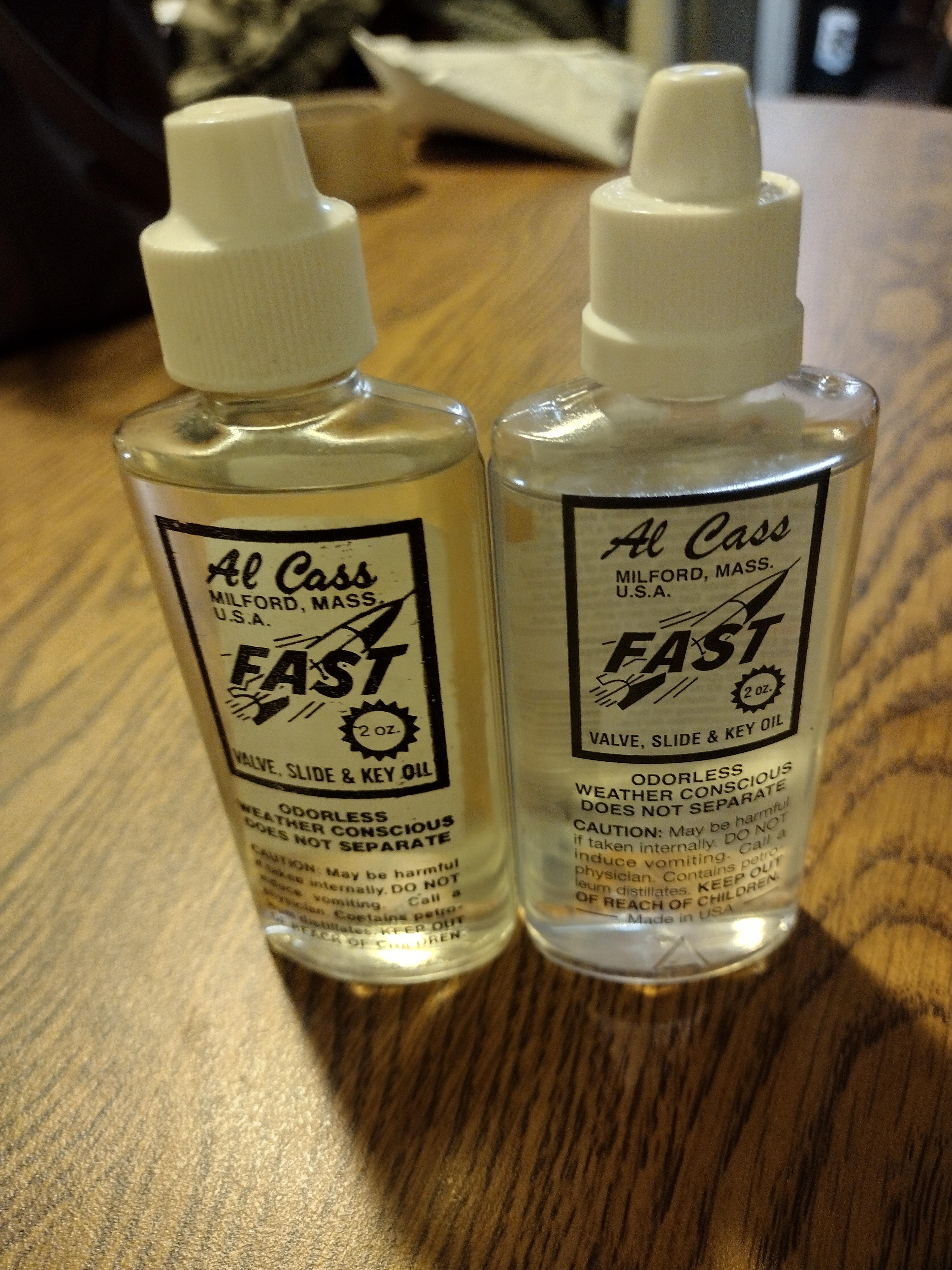 An old bottle of valve oil compared to a new bottle. | Scrolller