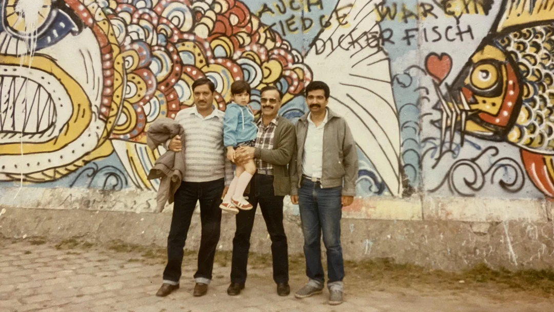 My grandparents posing by the Berlin Wall back in the 80s | Scrolller