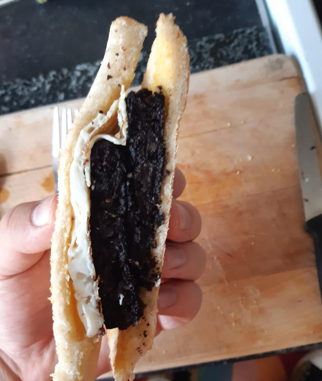 Black pudding and fried egg on toasted white bread | Scrolller