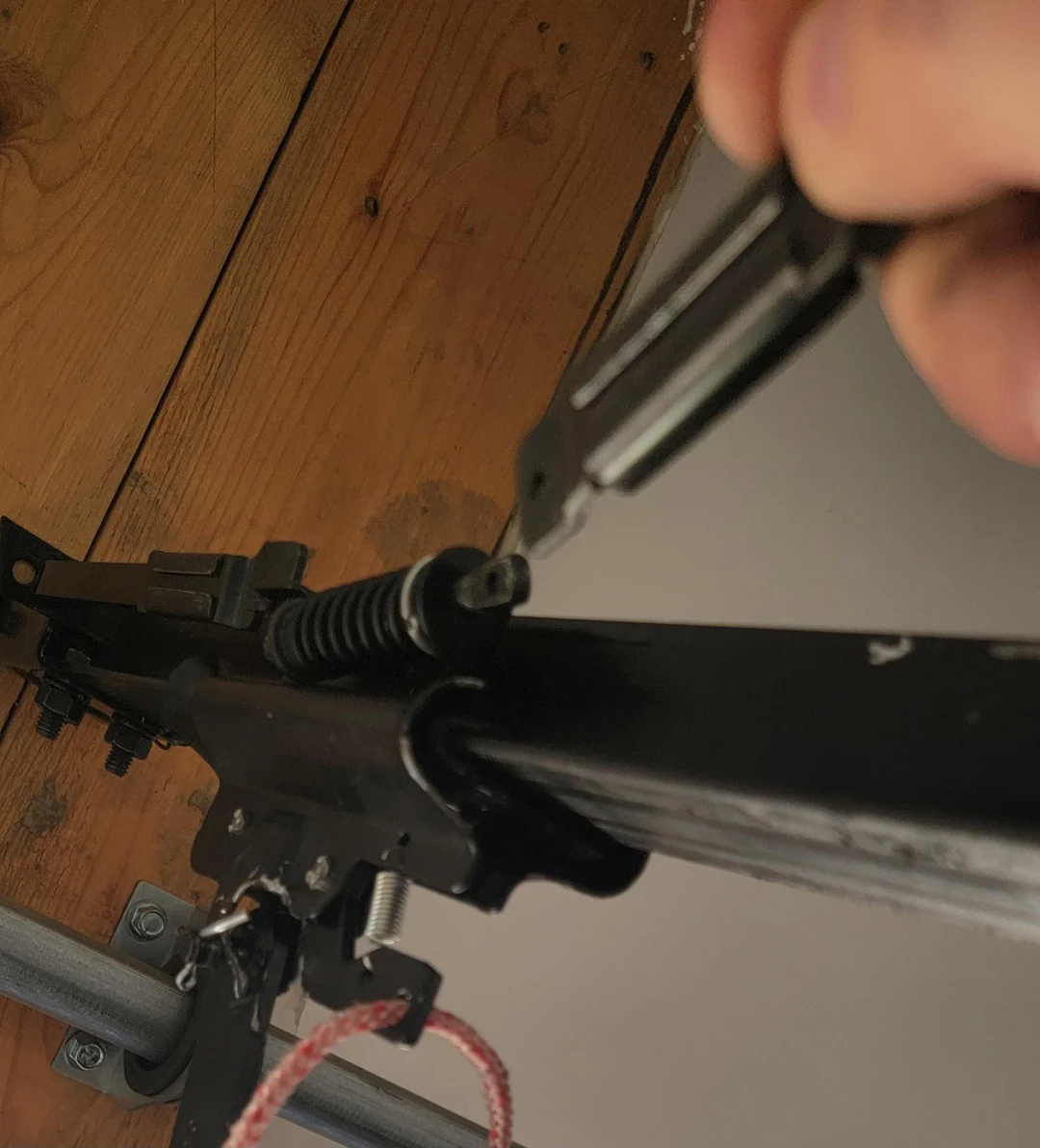 Garage door belt snapped off due to wife hitting door. How do I attach these 2 ends of the belt ...