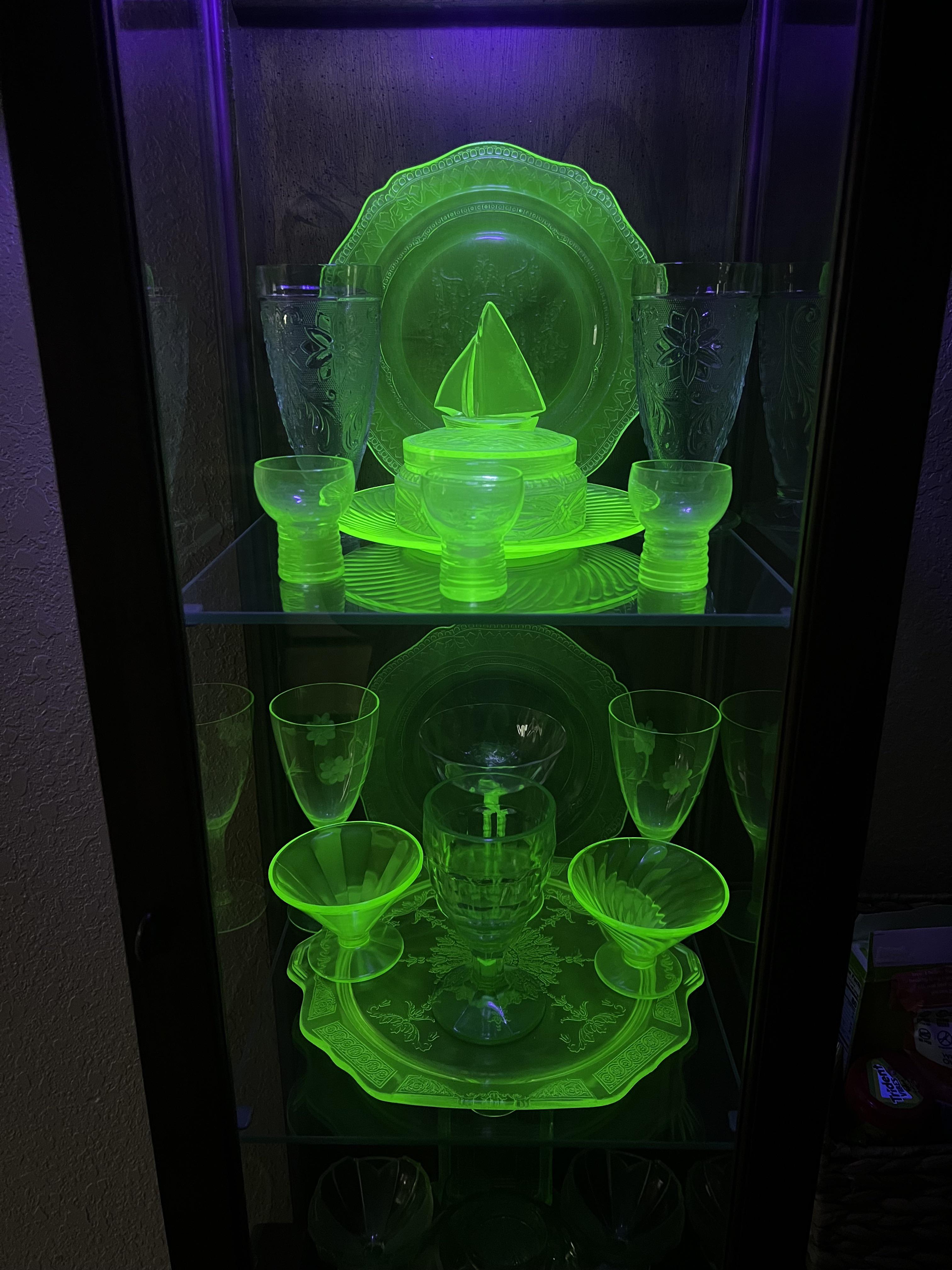 My depression era uranium glass collection glowing under UV light. | Scrolller