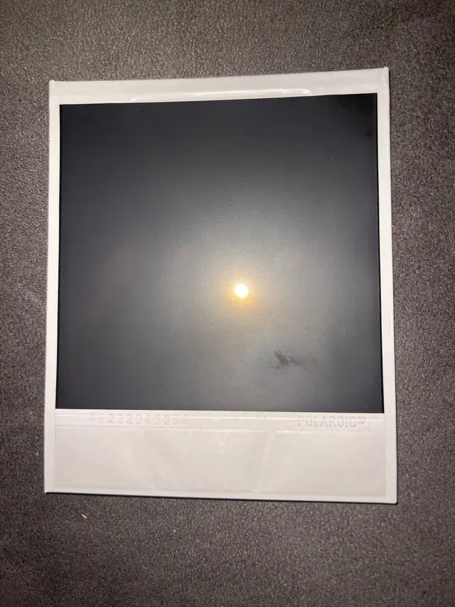 How can I remove smudges on the back of my polaroid pics? | Scrolller