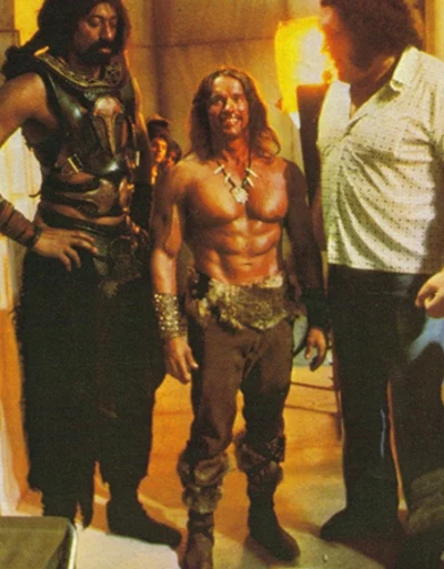 Arnold Schwarzenegger getting dwarfed by Wilt Chamberlain and André the Giant (1983) | Scrolller
