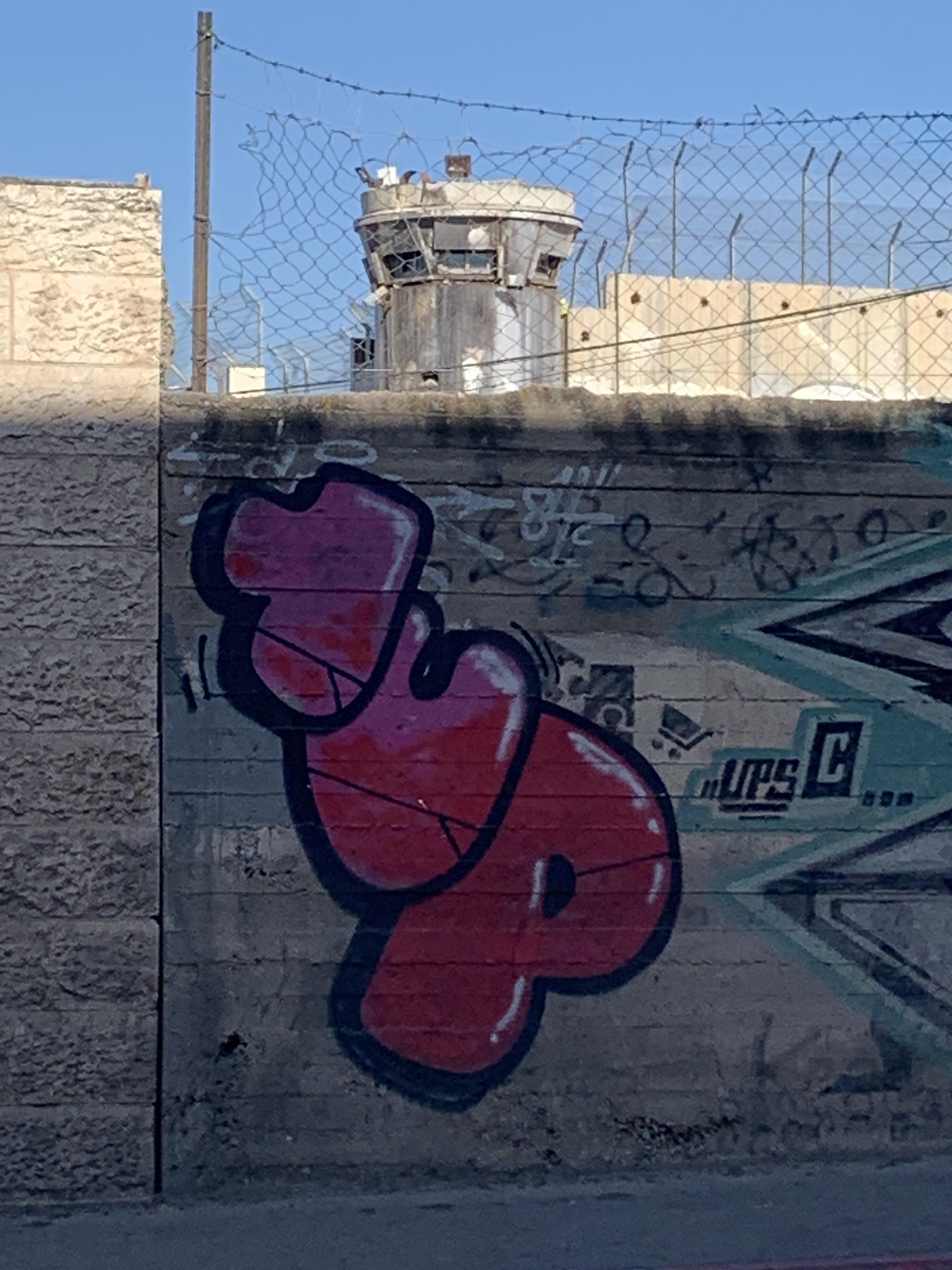 1UP in Bethlehem. With battle scared watch tower in the back | Scrolller