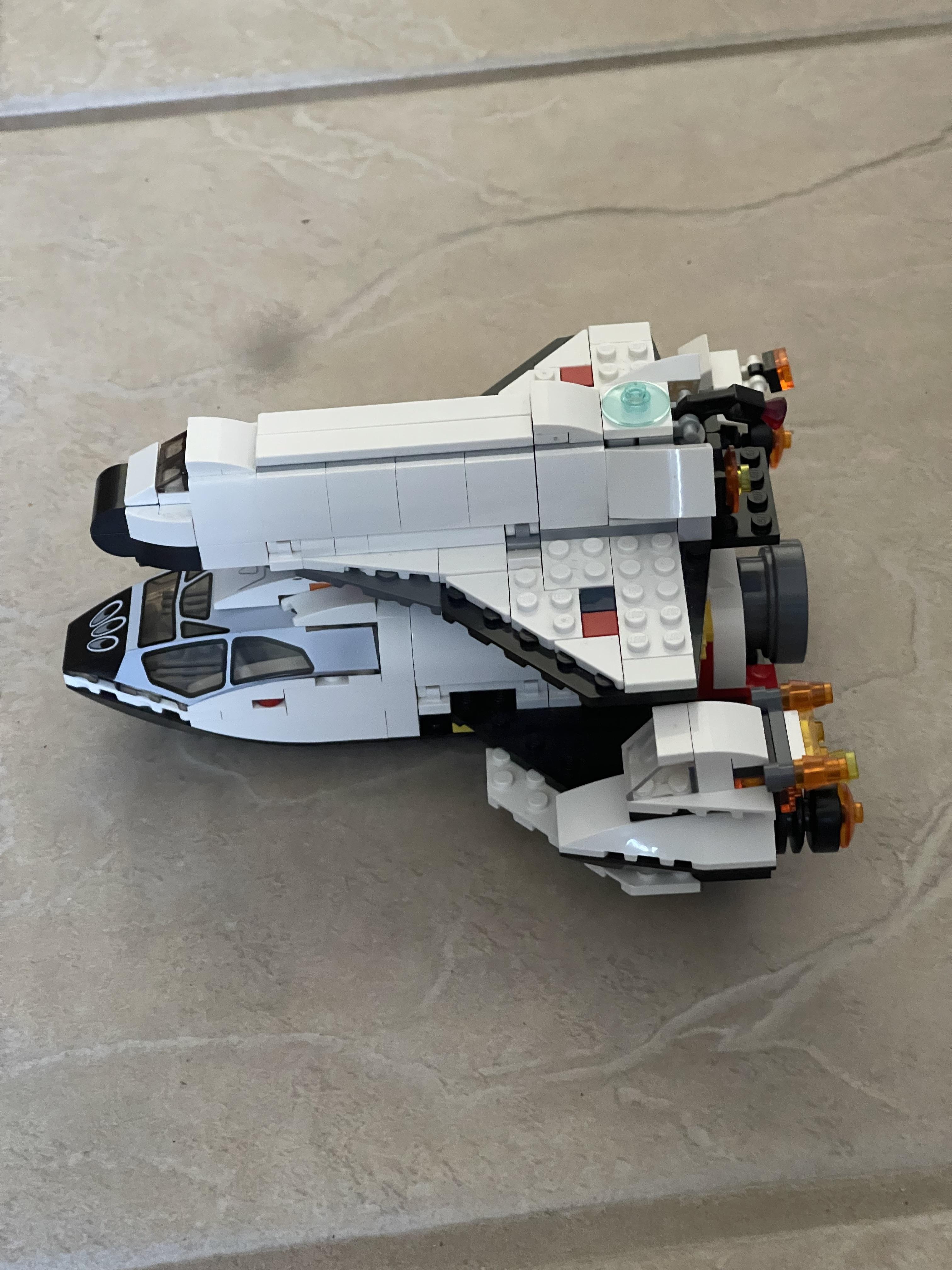 Kid was pretty proud of this "space shuttle family" I helped him cobble ...