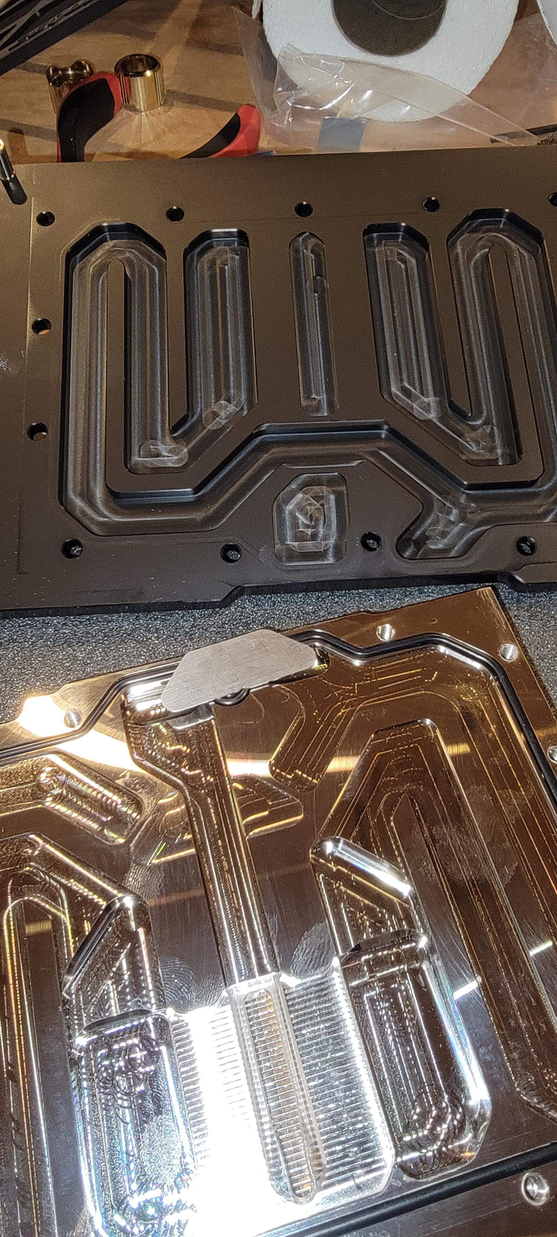 Trapezoid shaped piece of metal inside of block. | Scrolller