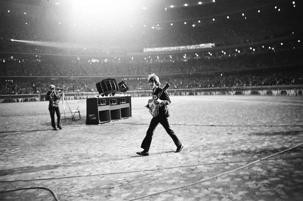 George Harrison walks to the stage at Dodger Stadium, Los Angeles, 28th August 1966 | Scrolller
