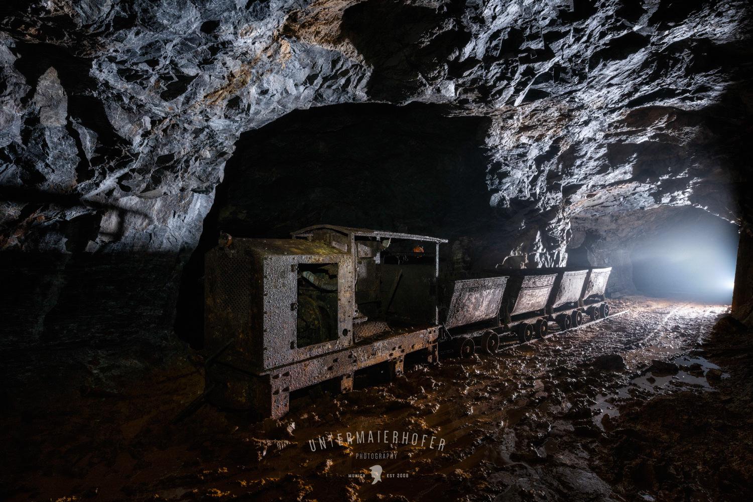 A mining train in an abandoned mine in Italy [oc] | Scrolller
