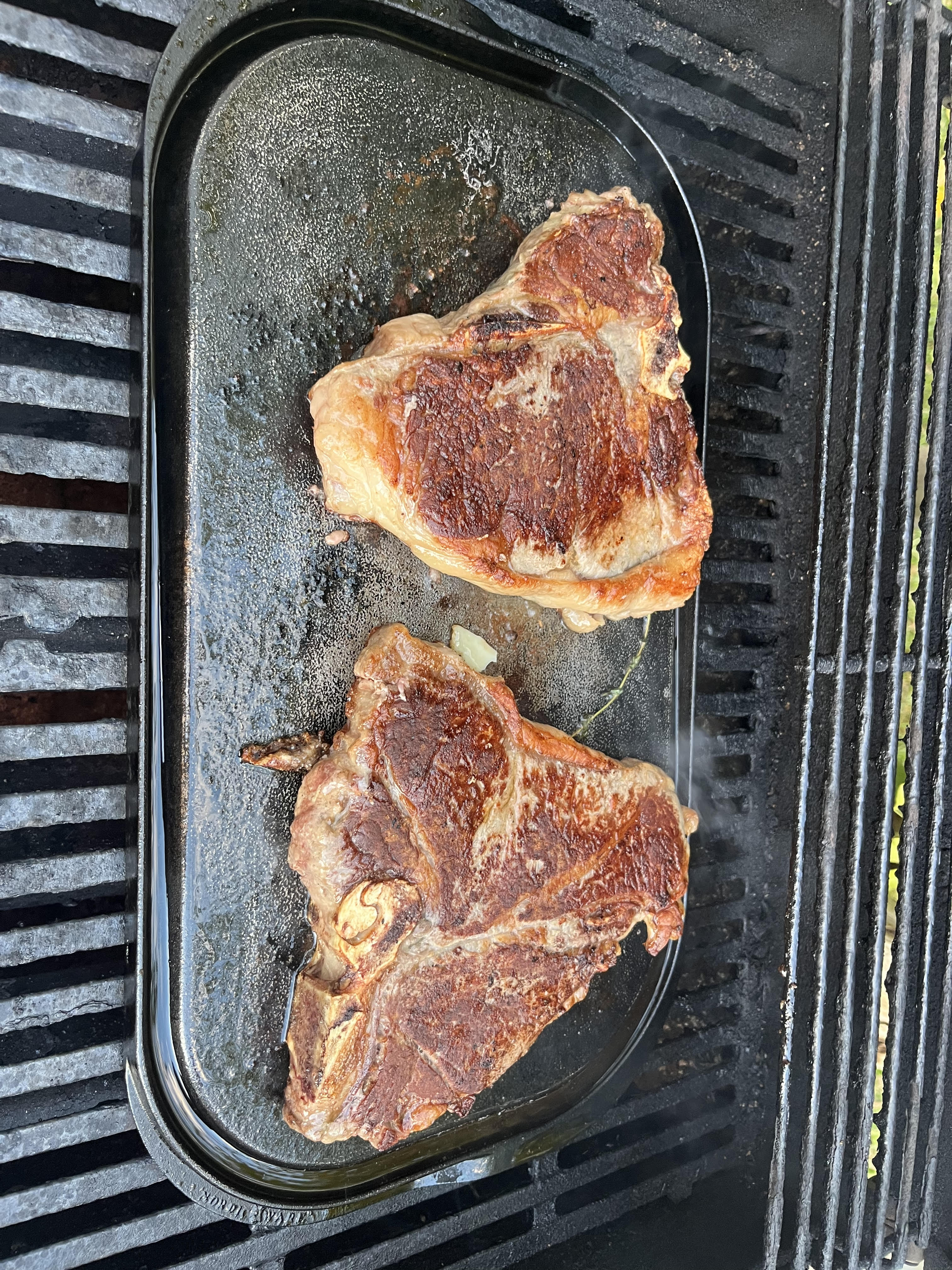 2 T-Bones on a griddle on a grill | Scrolller