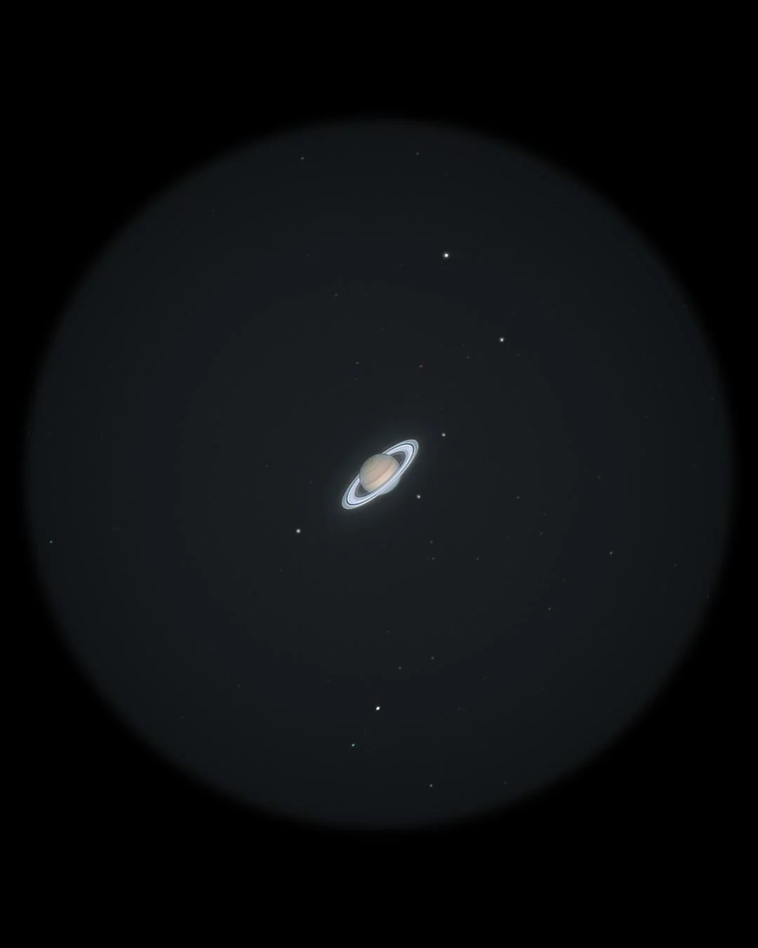 Saturn through a telescope | Scrolller