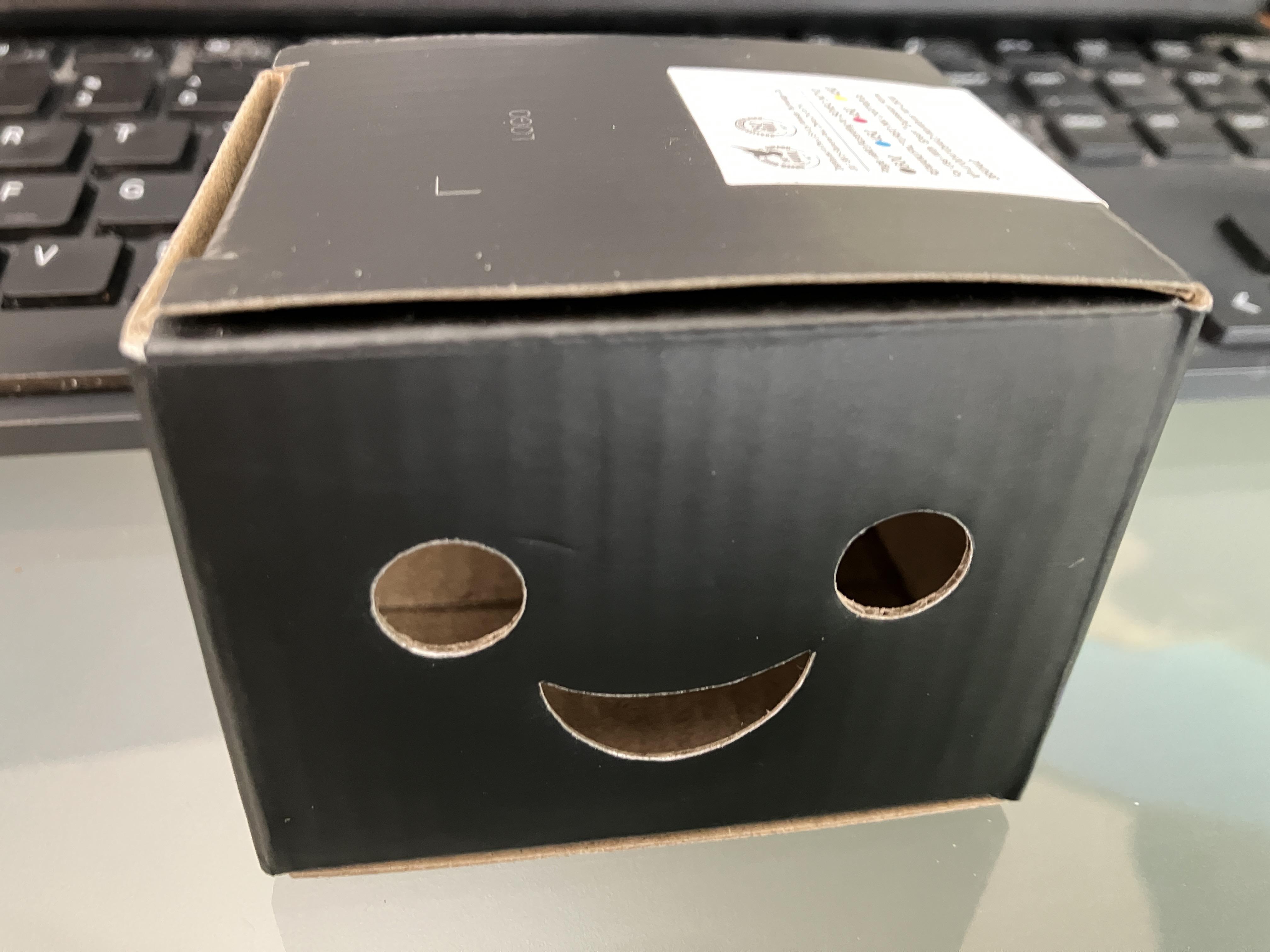 My printer ink cartridge packaging has a happy face cut into it. | Scrolller
