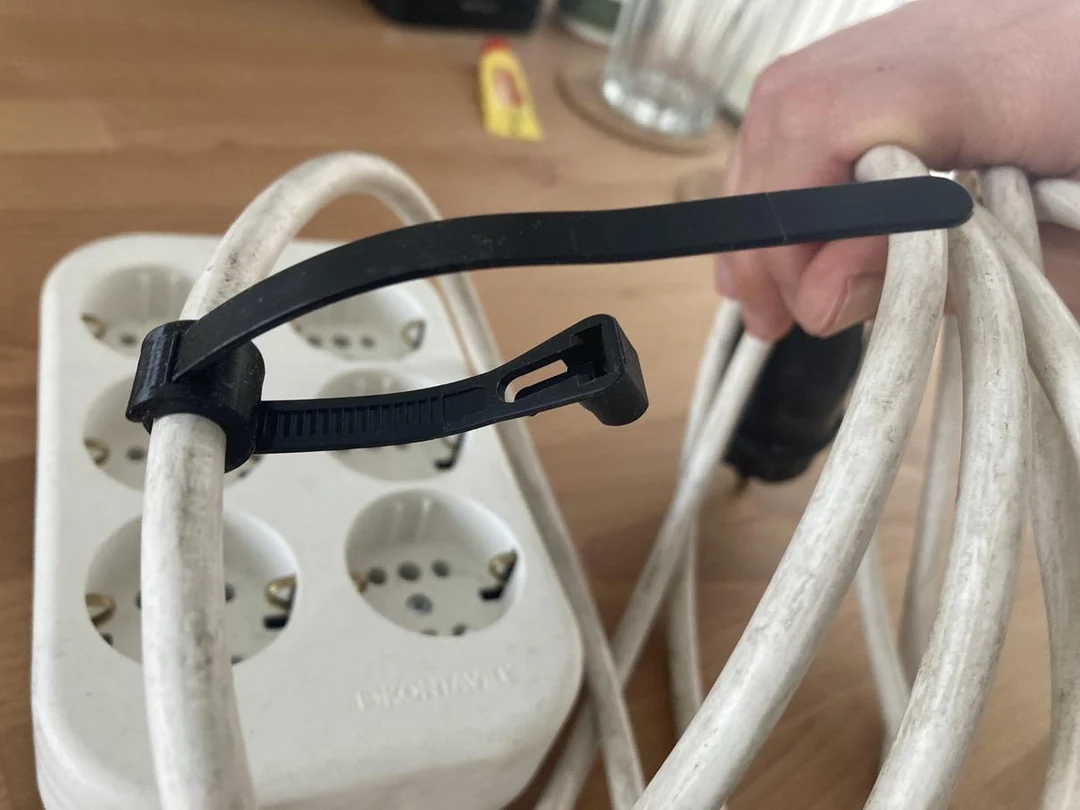 Clip for keeping reusable zip ties attached to cables (STL in comments) | Scrolller
