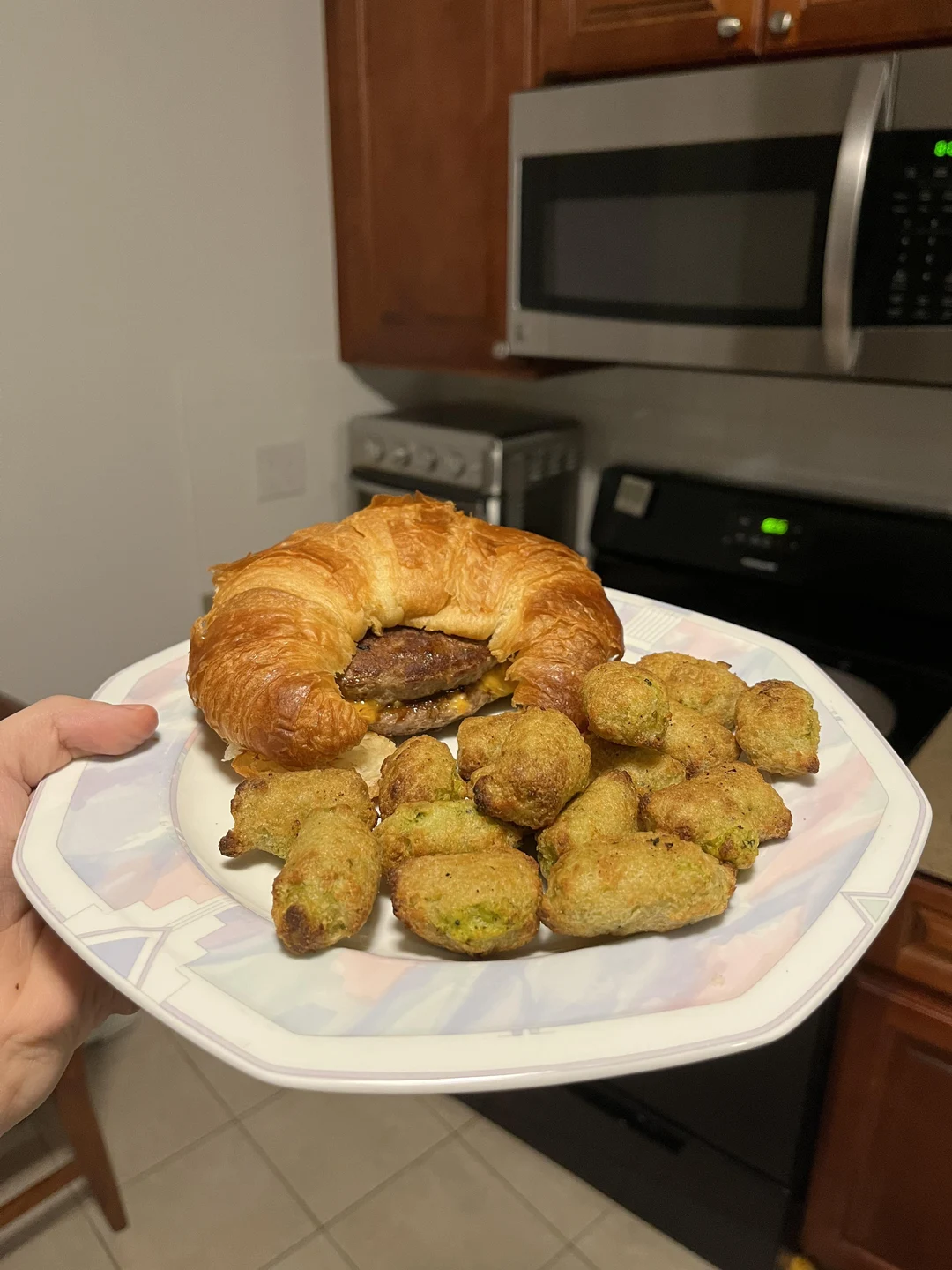 Double Turkey Burger with Cheddar Cheese on a Croissant with Broccoli Veggie Tots | Scrolller