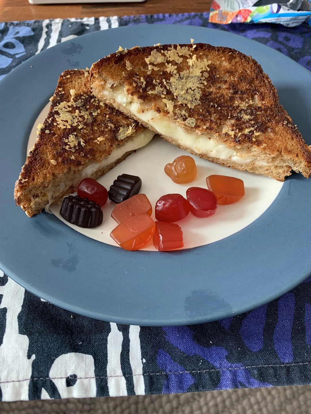 Muenster, sharp cheddar, and pepper jack on whole grain, w/ Irish butter spread and Parmesan ...