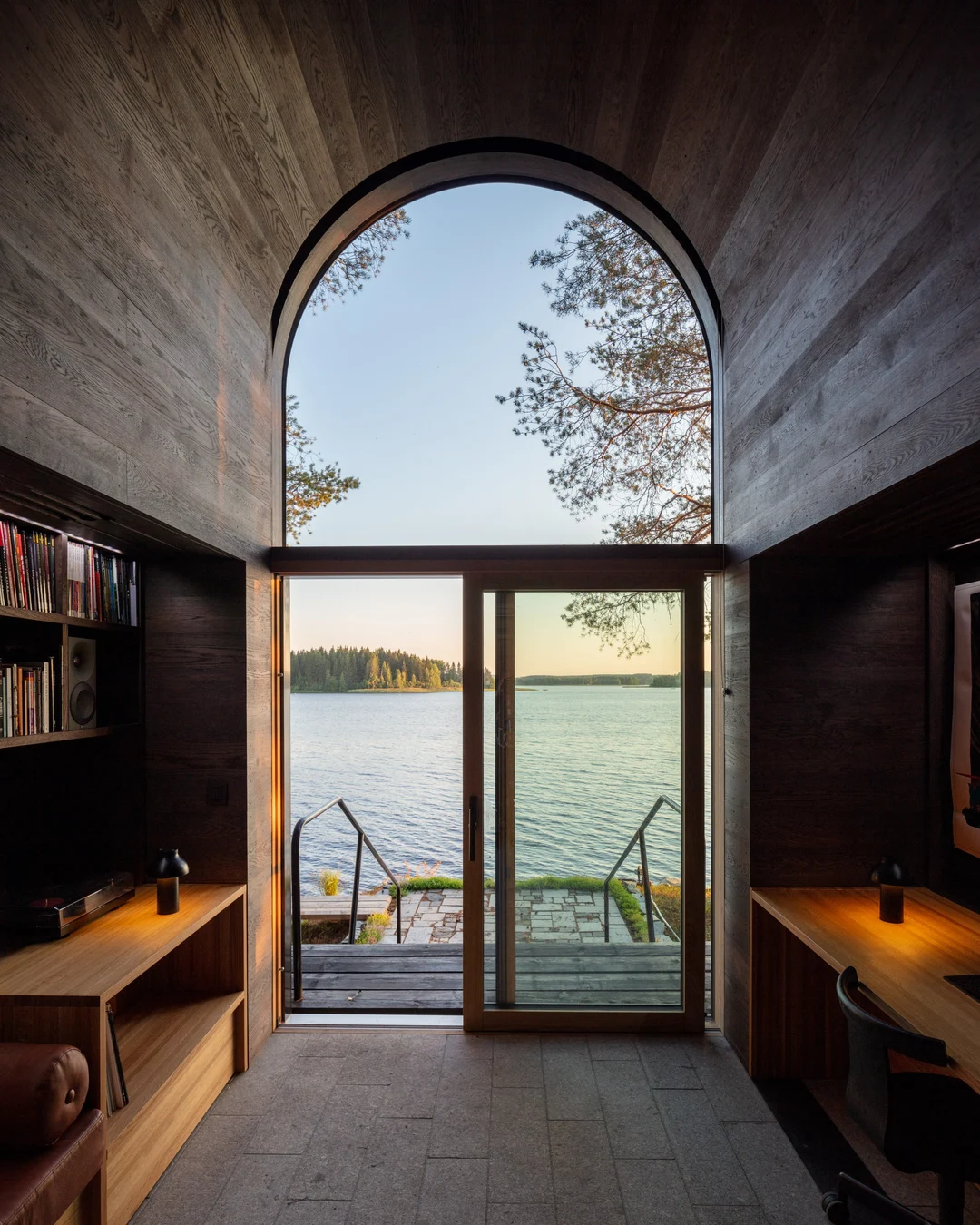 Small cabin with an arched window on the shores of Lake Porovesi, Northern Savonia, Finland ...