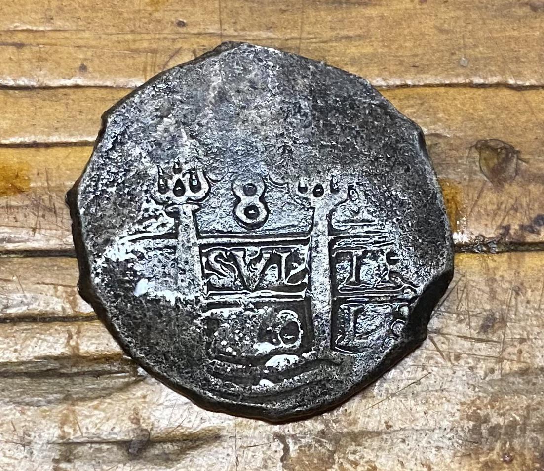 8 Reales. Pirate treasure from the Whydah Gally, recovered by archaeology field team in July ...