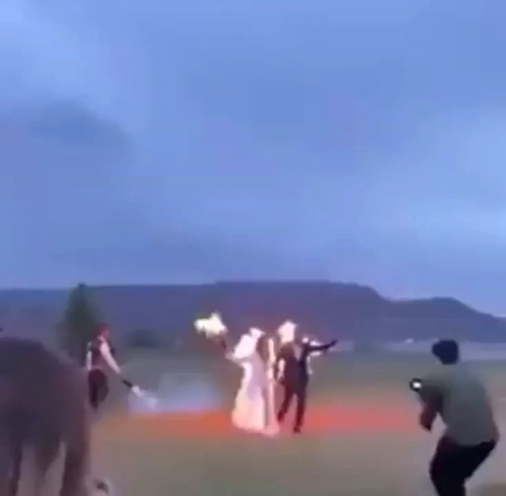 Bride and groom set fire to their outfits | Scrolller