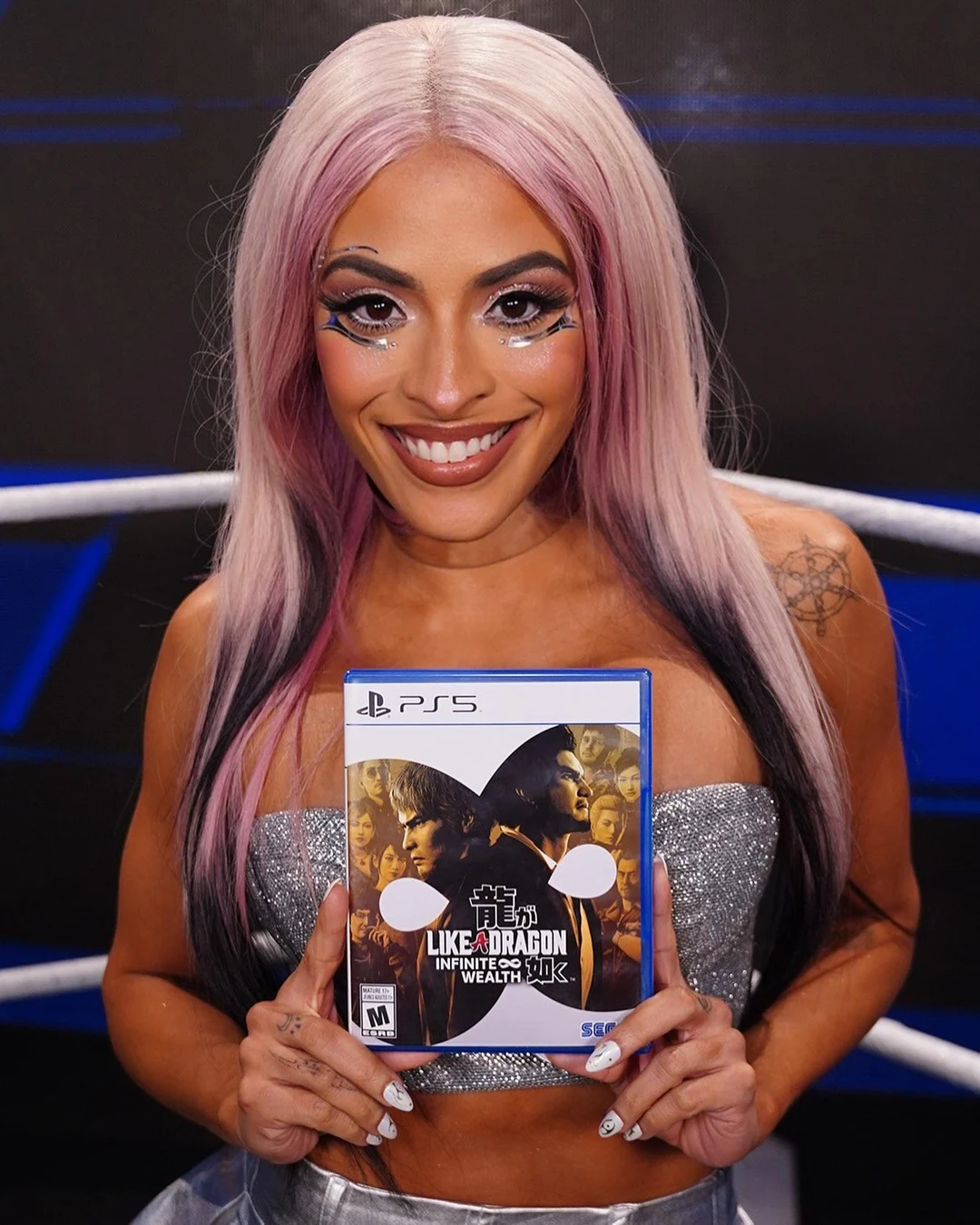 Zelina Vega (holding an all time classic) | Scrolller