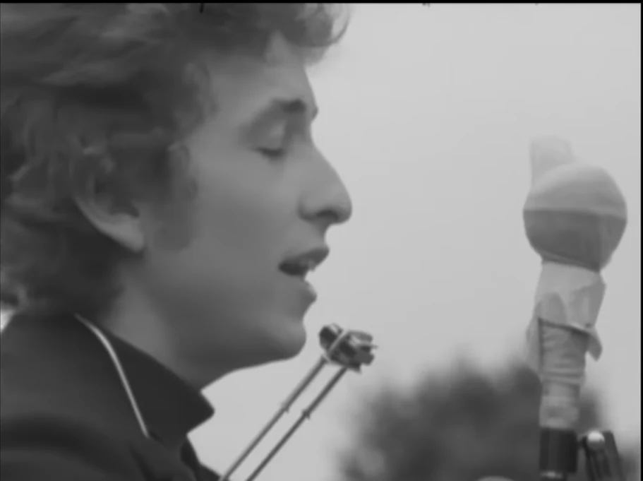 Bob Dylan Using a Condom for a Wind Screen 1964. | Scrolller