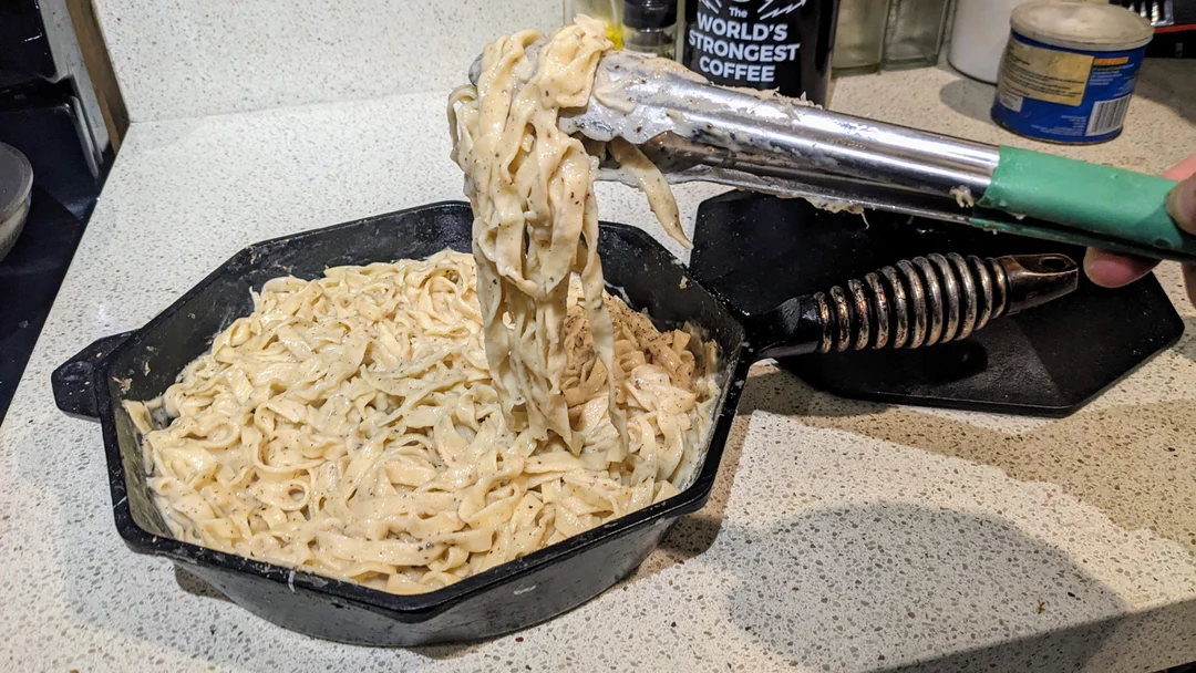 cacio e pepe, pasta made from scratch. cast iron resisted cheese from sticking | Scrolller