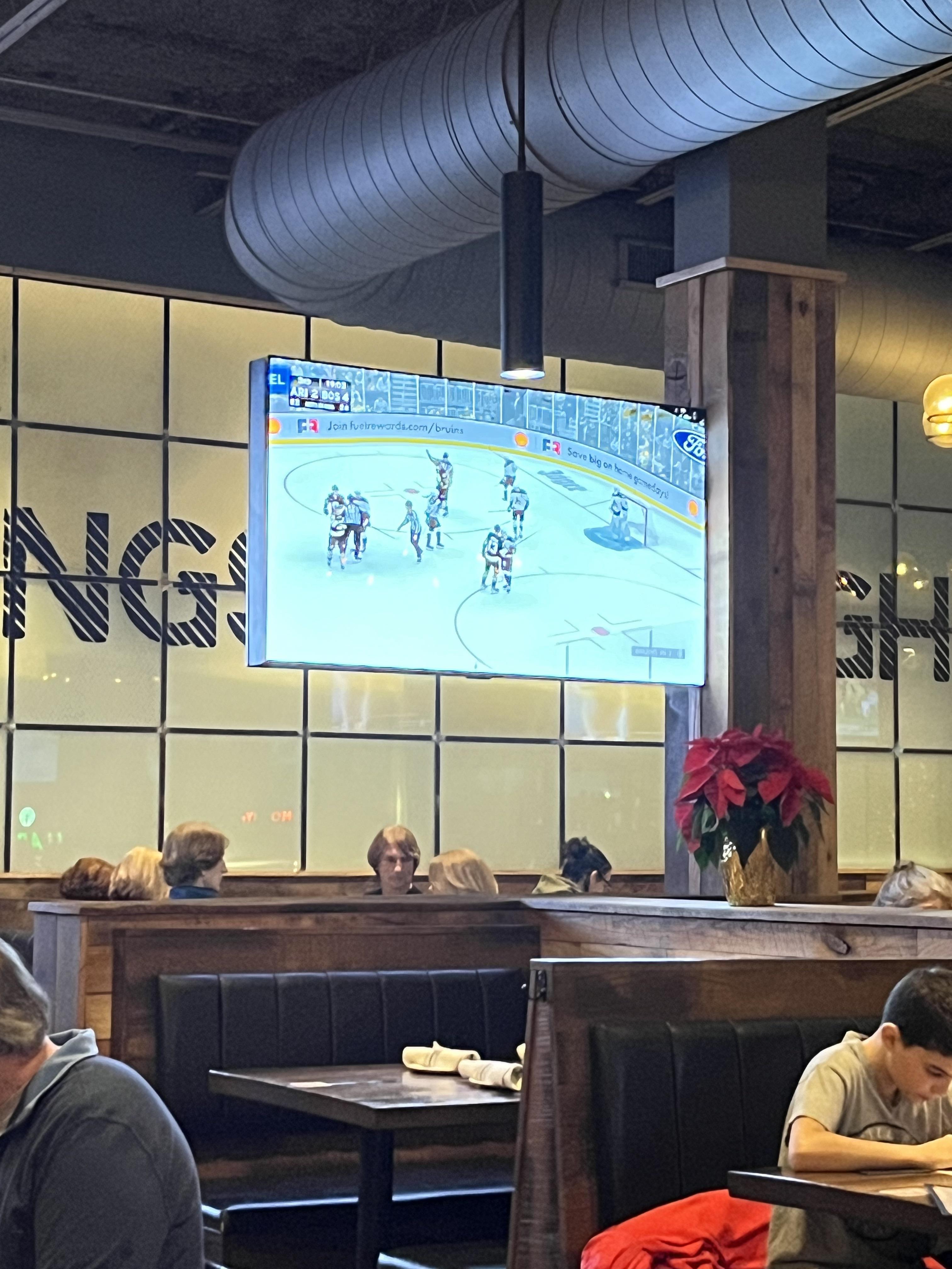 TV floating off of pillar in restaurant | Scrolller