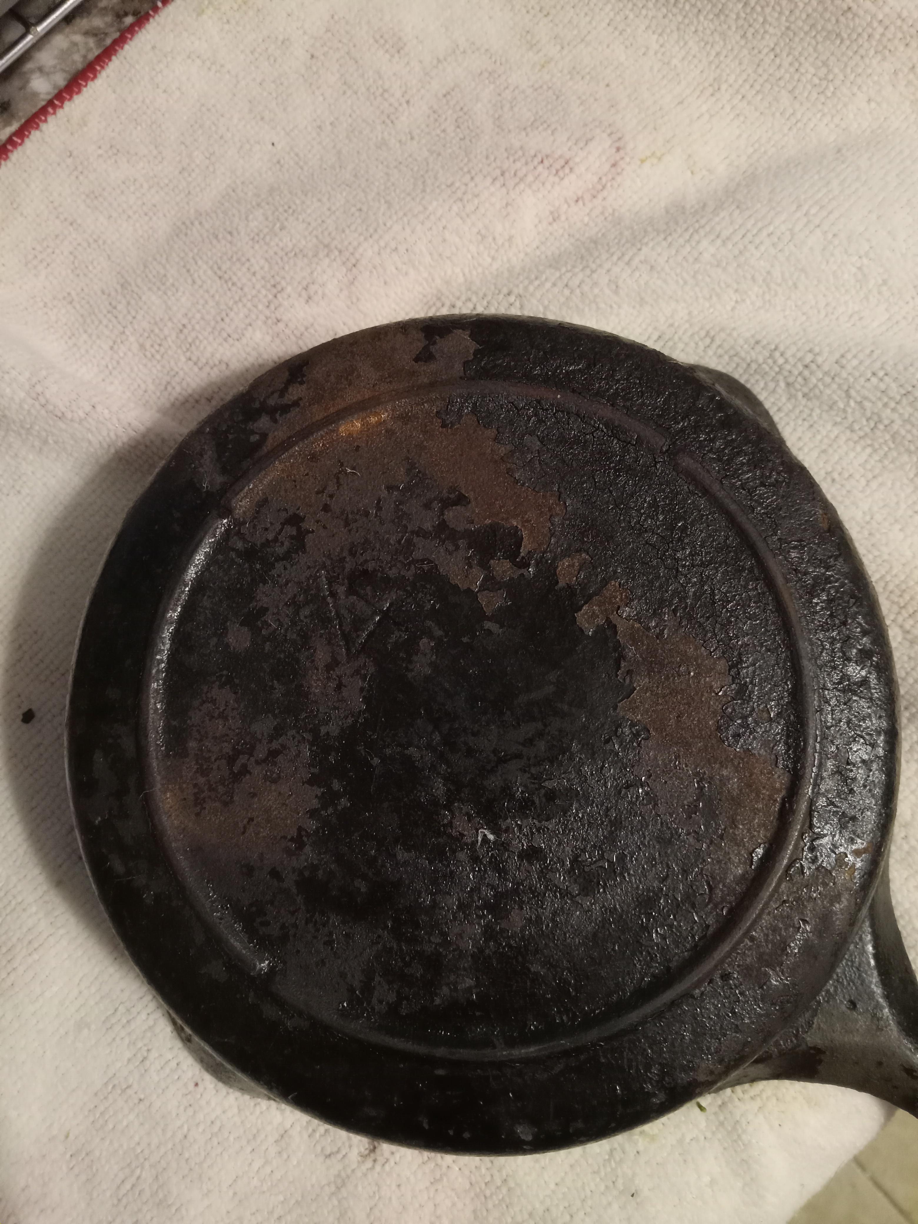 What is my pan doing? Is it paint or carbon seasoning flaking? | Scrolller
