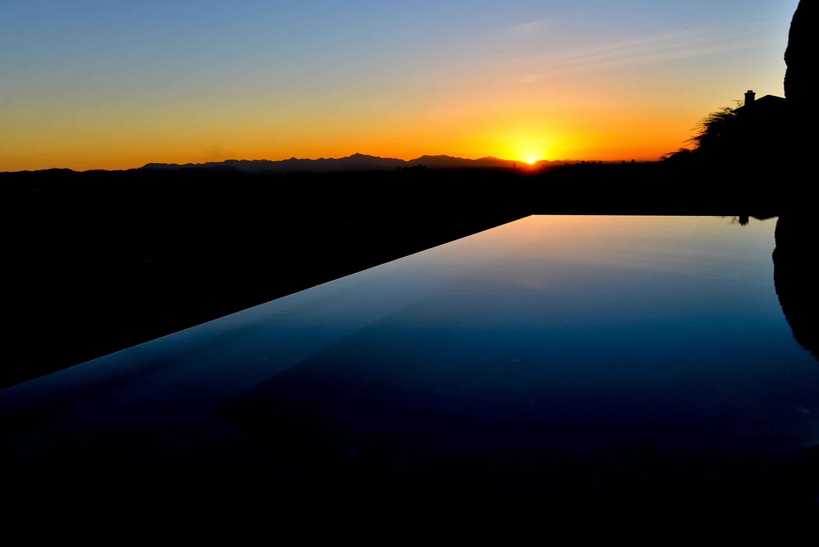 Arizona sunset against infinity pool | Scrolller