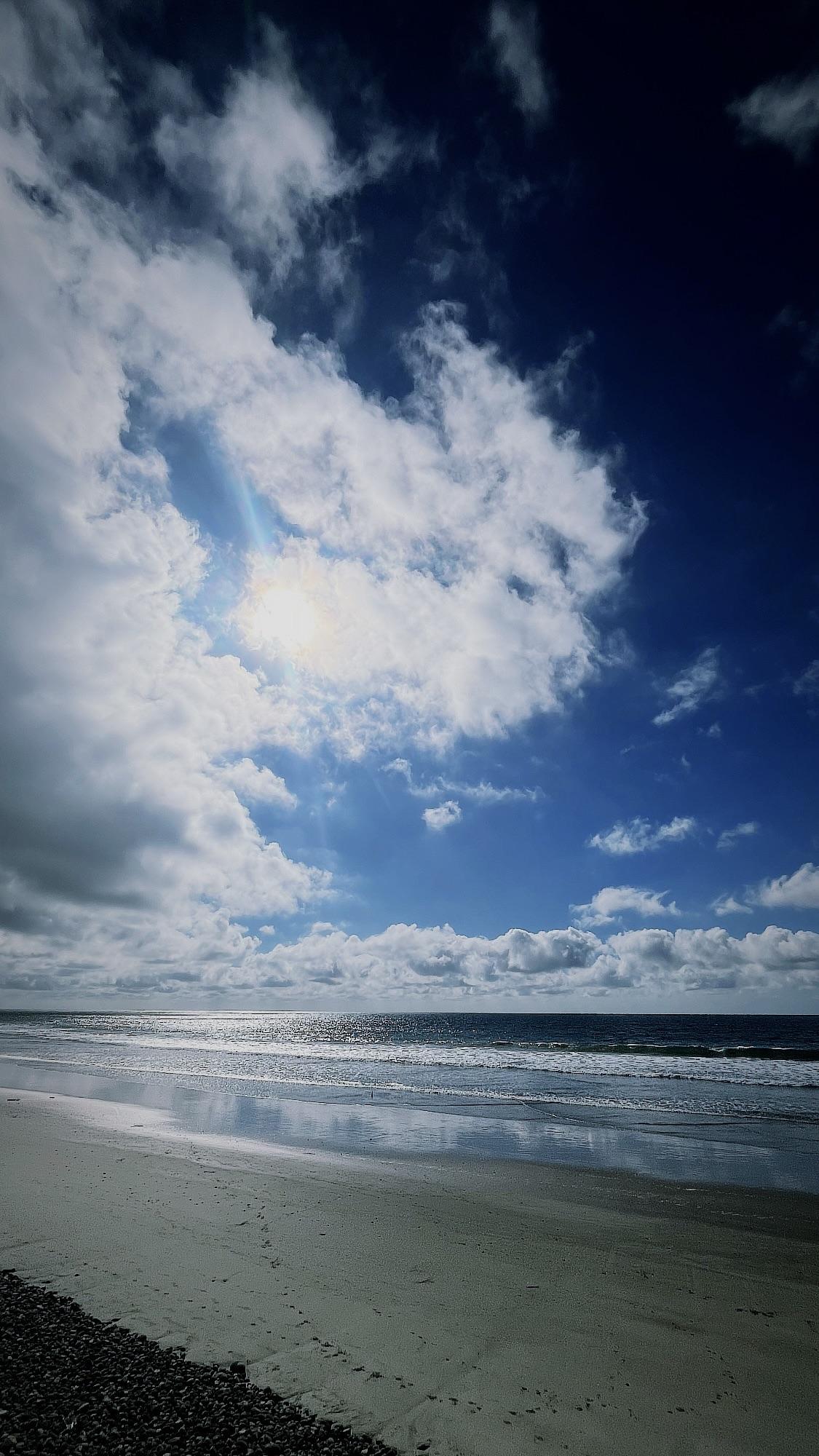 Something about the clouds and the ocean | Scrolller