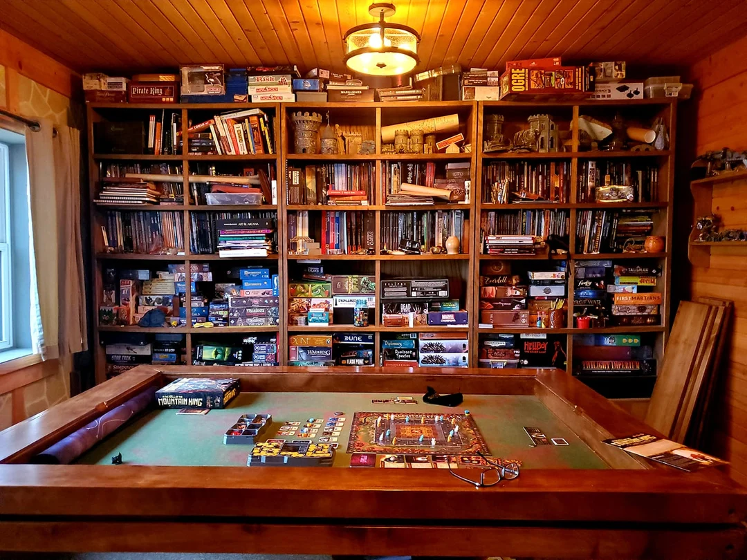 Our game room with board games and RPG books | Scrolller