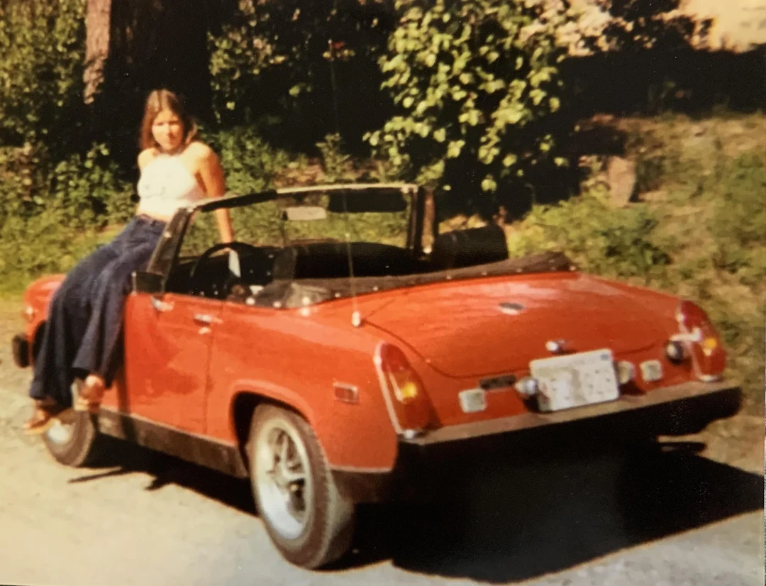 My sister, 1976, Anchorage Alaska, showing off her new MG Midget | Scrolller