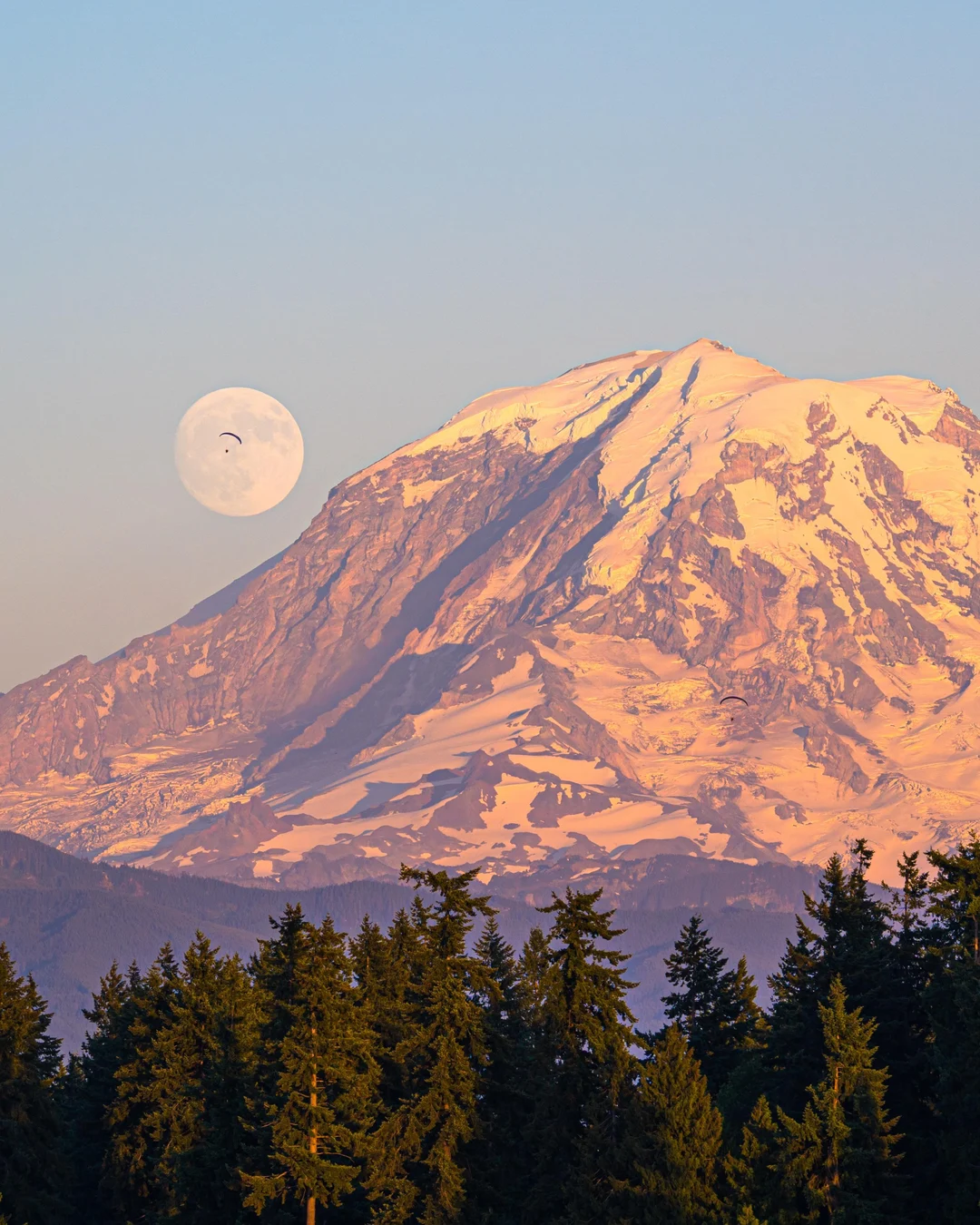 Got an unexpected photobomb while shooting the full moon rising over Rainier | Scrolller