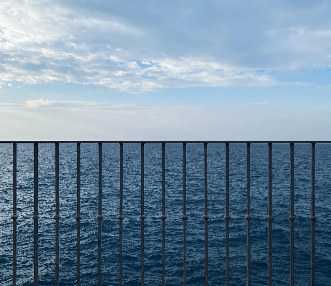 The horizon, ocean, and railing lined up | Scrolller