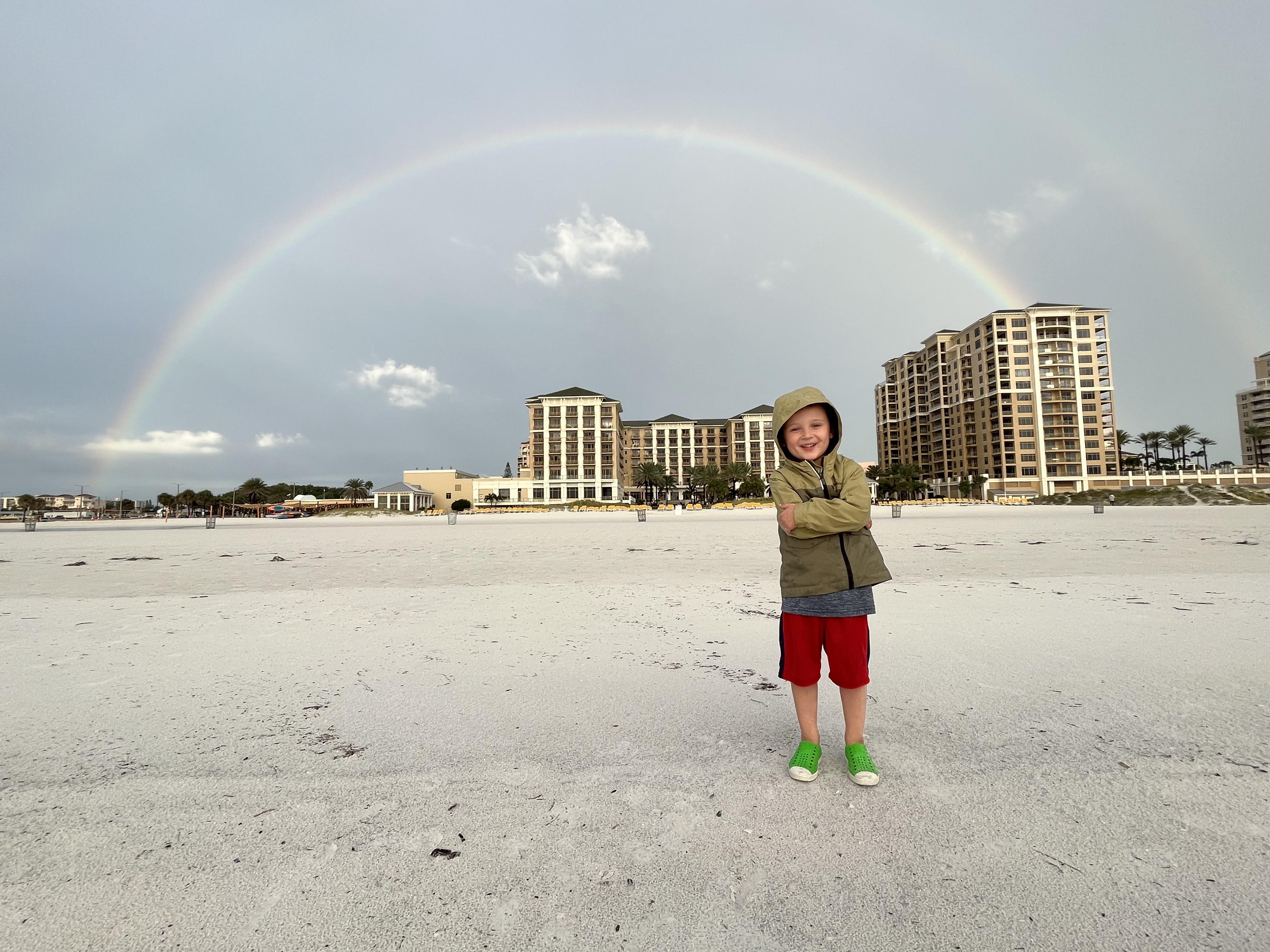 Got a pic of my 4 yo at the beach under a double rainbow | Scrolller