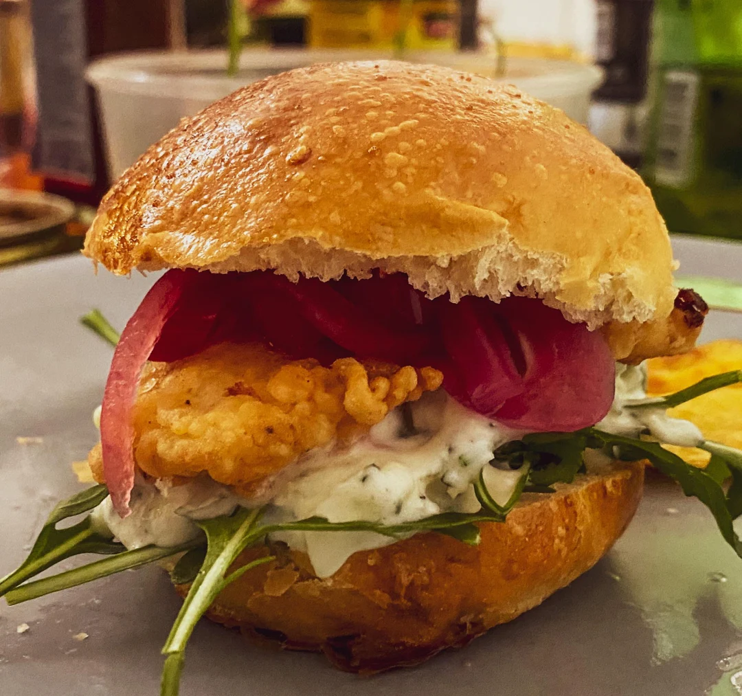 Homemade fried chicken sandwich; homemade buns, tzatziki, pickled onions and pickled chillies ...
