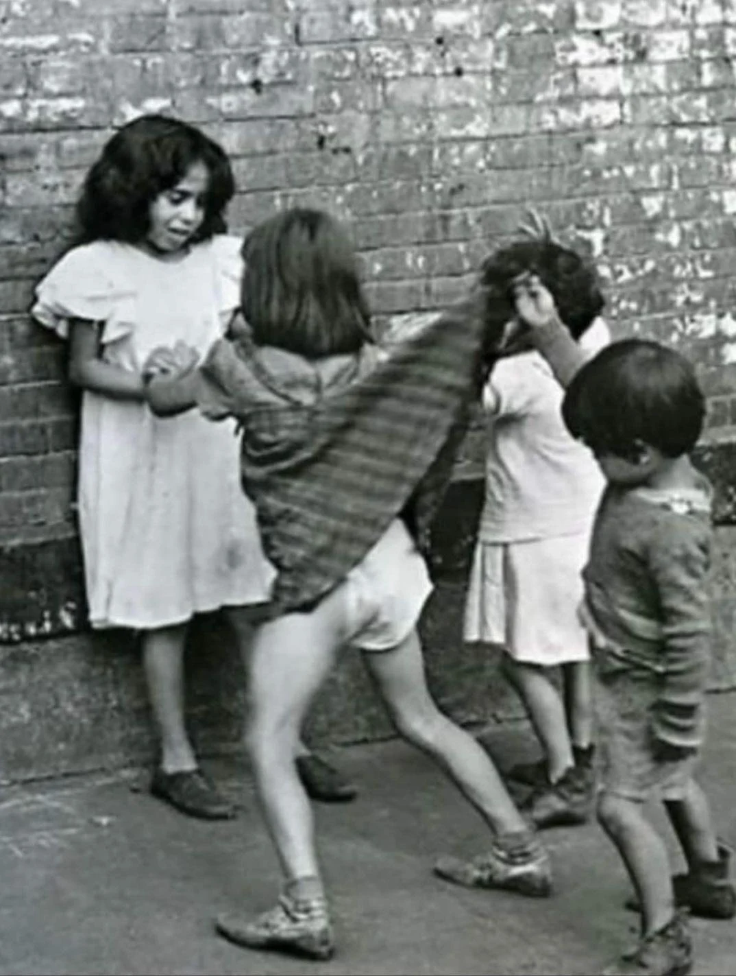 Photograph by HELEN LEVITT 1940. She captured the bustle, squalor and beauty of everyday life in ...