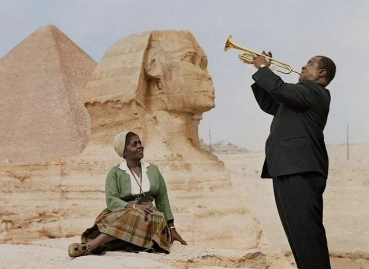 Louis Armstrong playing for his wife Lucille in front of the Sphinx, Egypt, 1961! | Scrolller