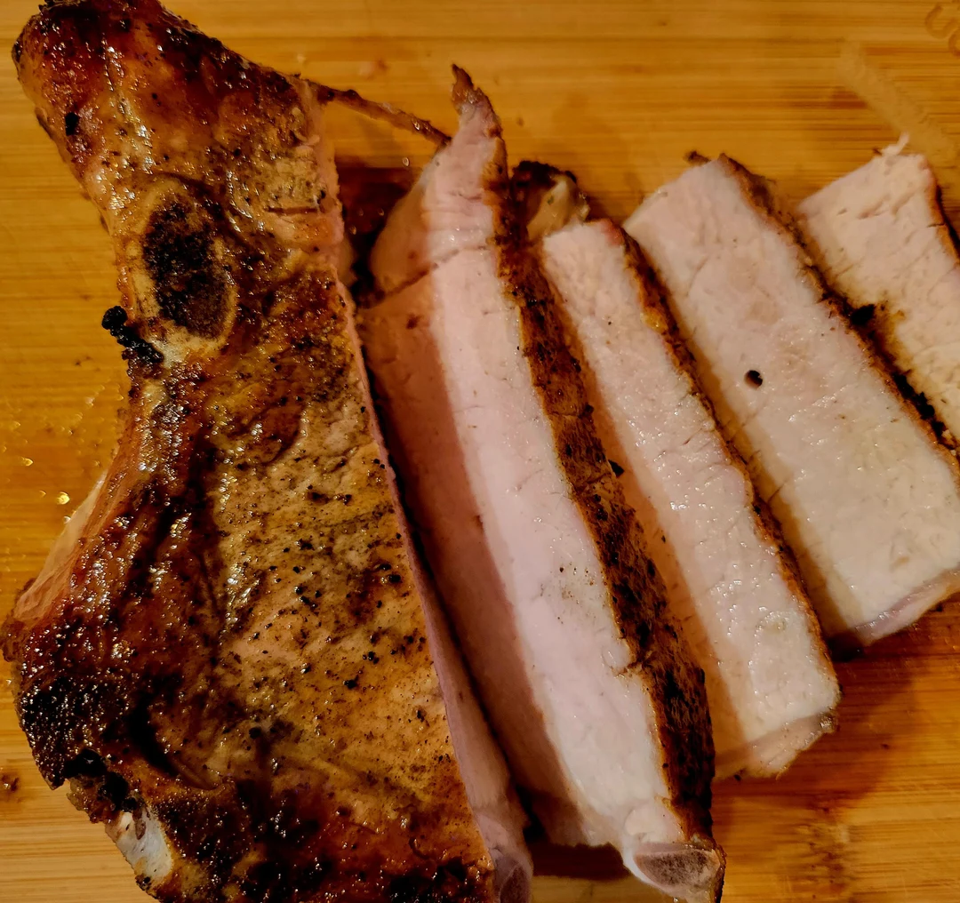 Thick-cut bone-in pork chop, pulled at 145° | Scrolller