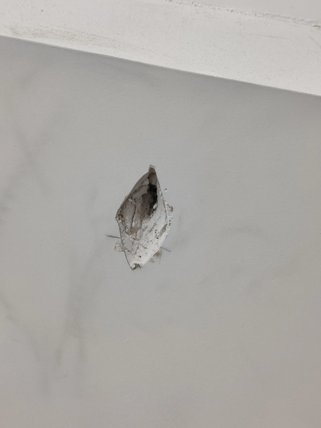 The client made a hole in the drywall. I had to remove what was broken with my knife but get ...