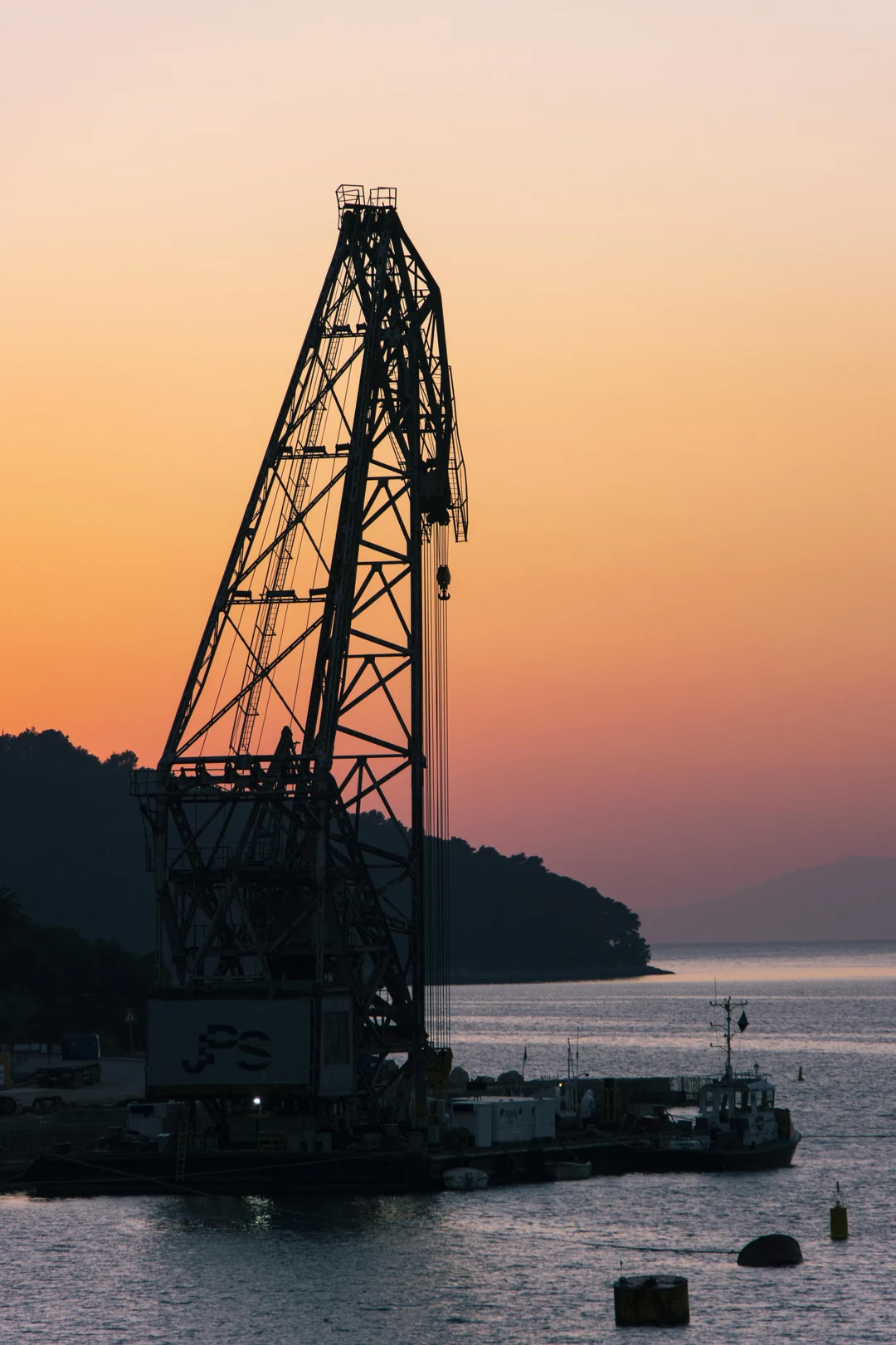 Silhouette of huge crane at sunset, Croatia | Scrolller
