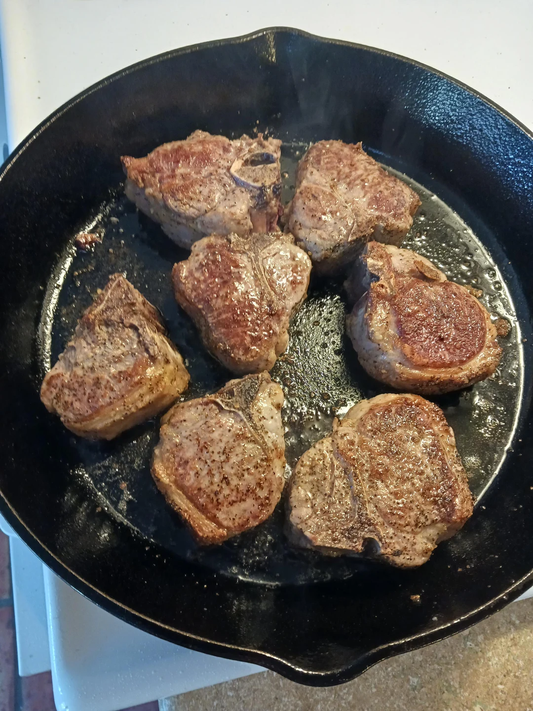 lamb chops seared rare in tallow | Scrolller