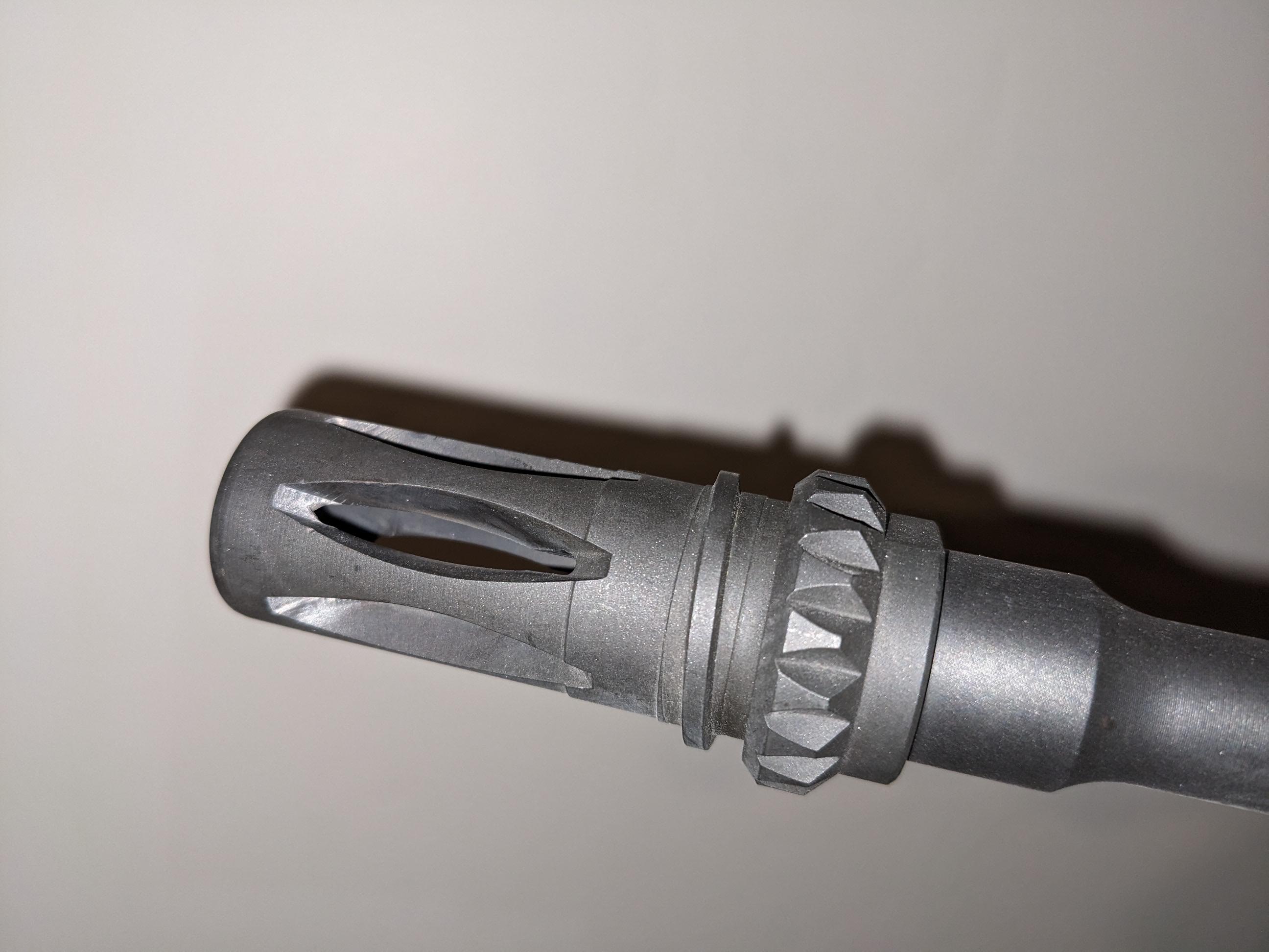 What kind of muzzle device is this? | Scrolller