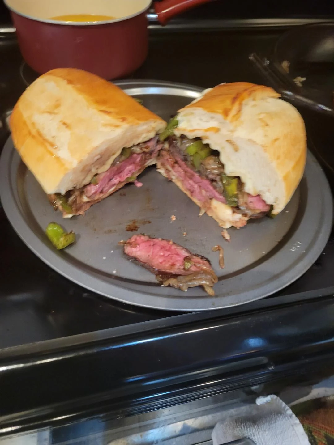 fancy Philly. provolone sirloin rare, onions, and green peppers on french bread. | Scrolller