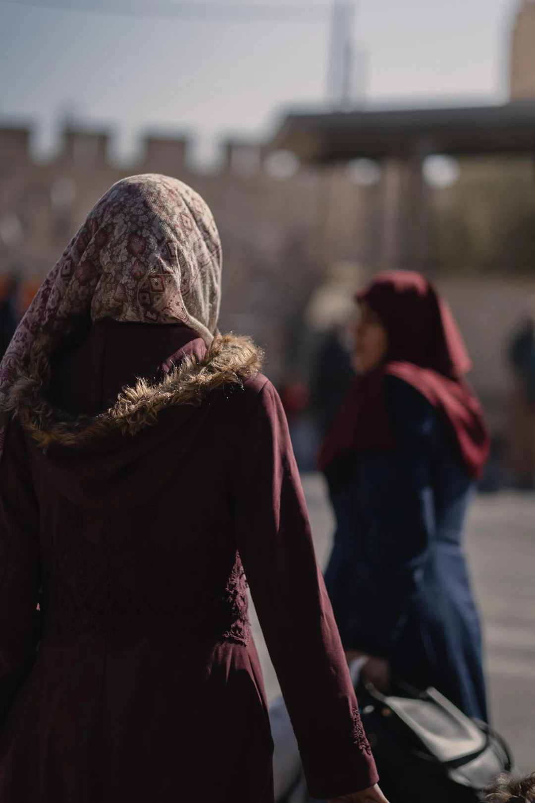 Palestinian women crossing the street at Damascus Gate | Scrolller